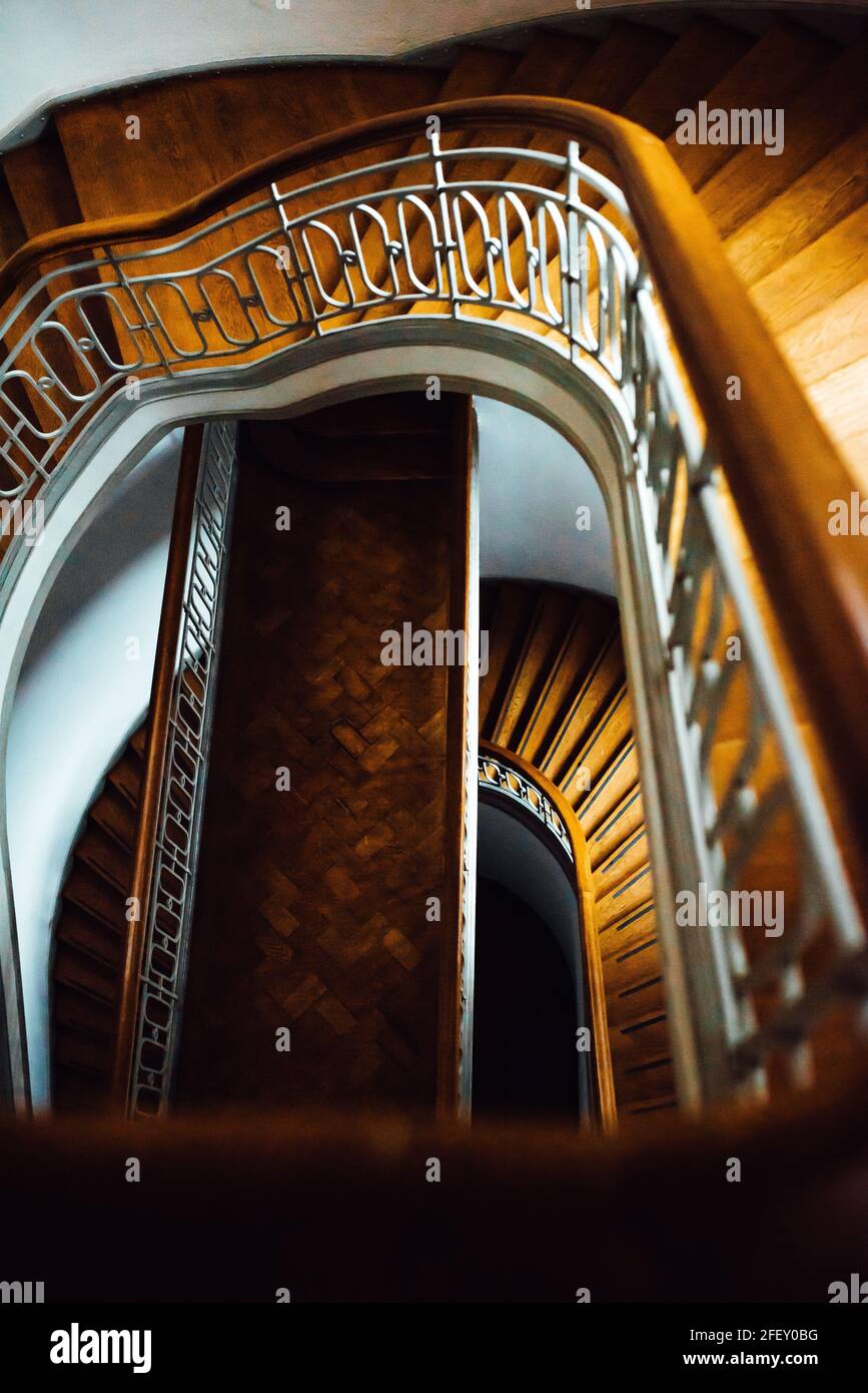 old vintage semicircular staircase with wooden stairs Stock Photo - Alamy