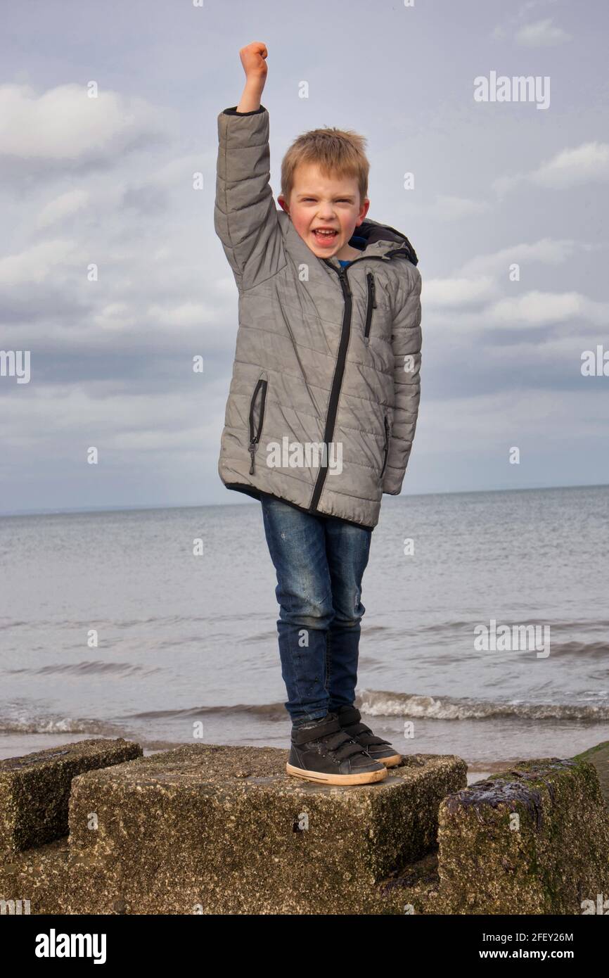 Young boy at the beach Stock Photo - Alamy