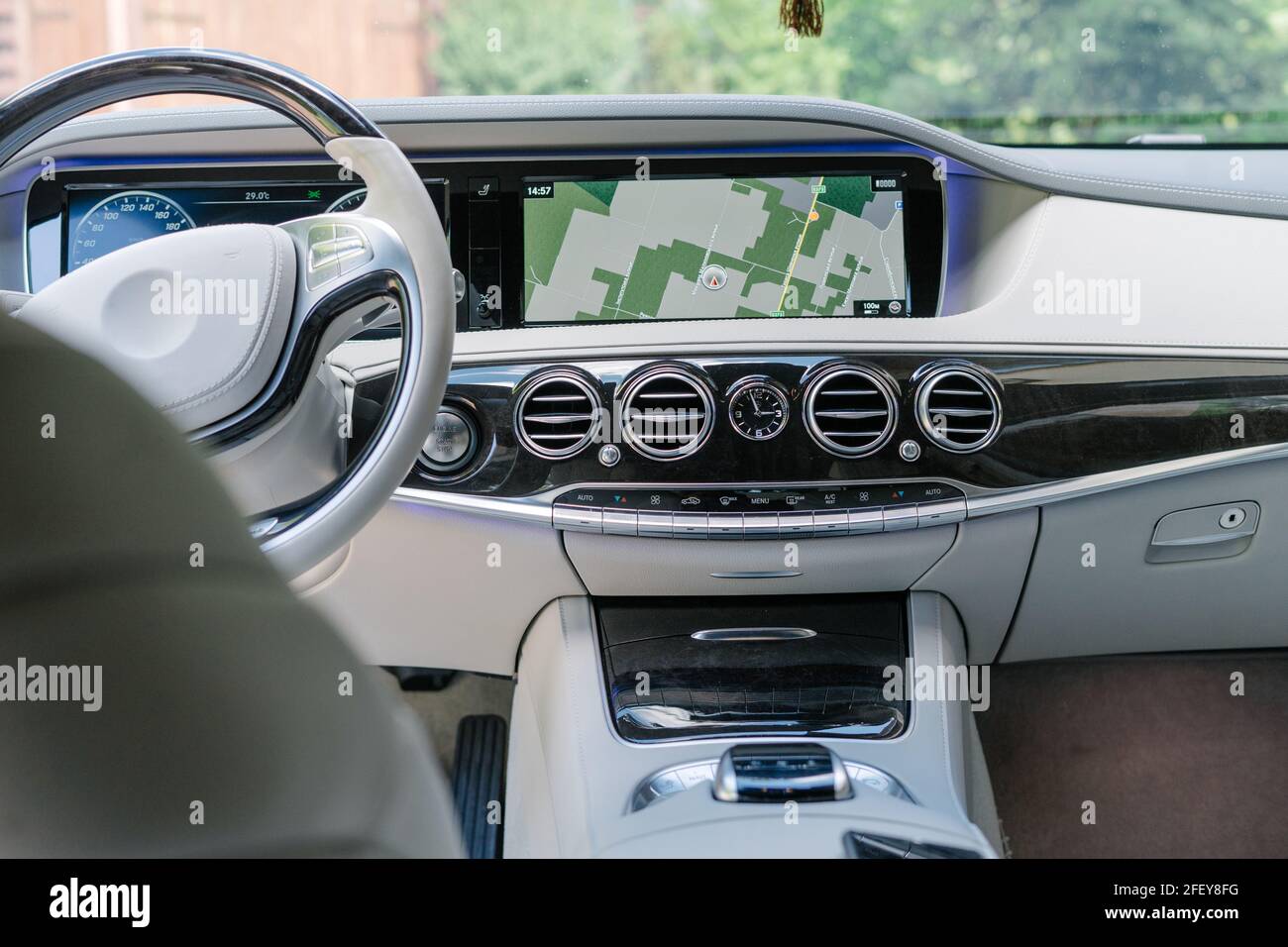 Modern car interior in light colors and navigation device Stock Photo ...