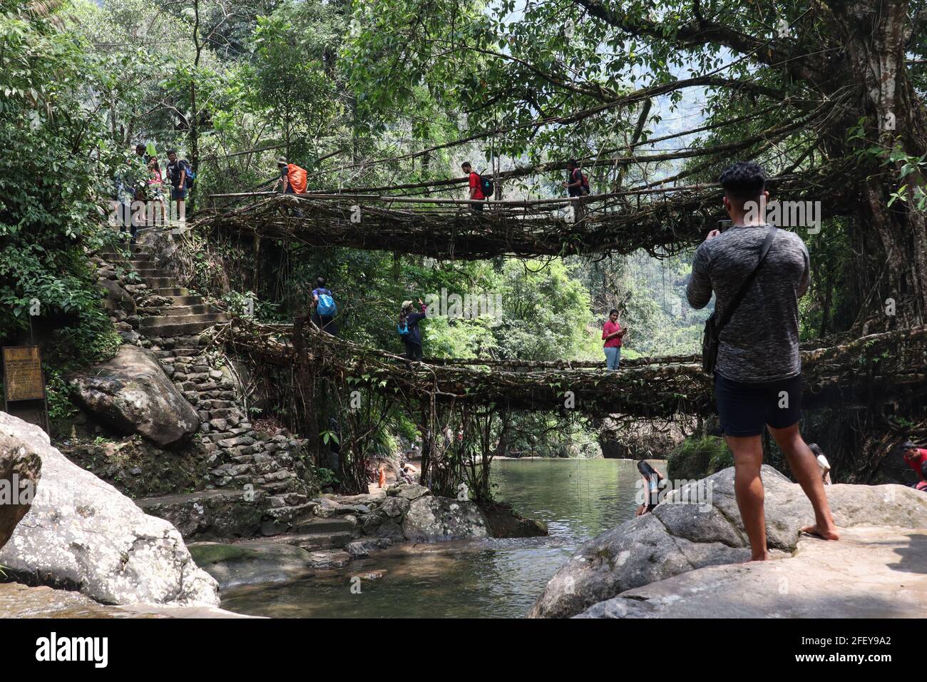 Tourists visits the double decker living root bridge amid COVID-19 coronavirus pandemic, in ...