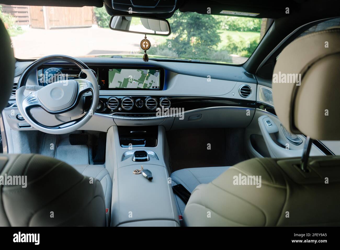 Modern car interior in light colors and navigation device Stock Photo ...