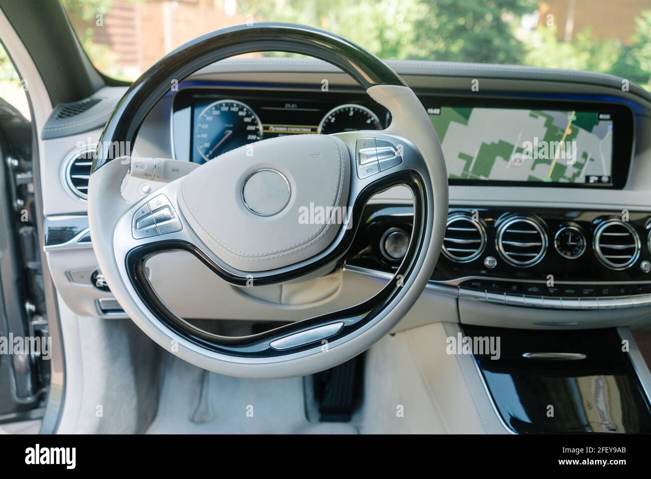 Modern car interior in light colors and navigation device Stock Photo ...
