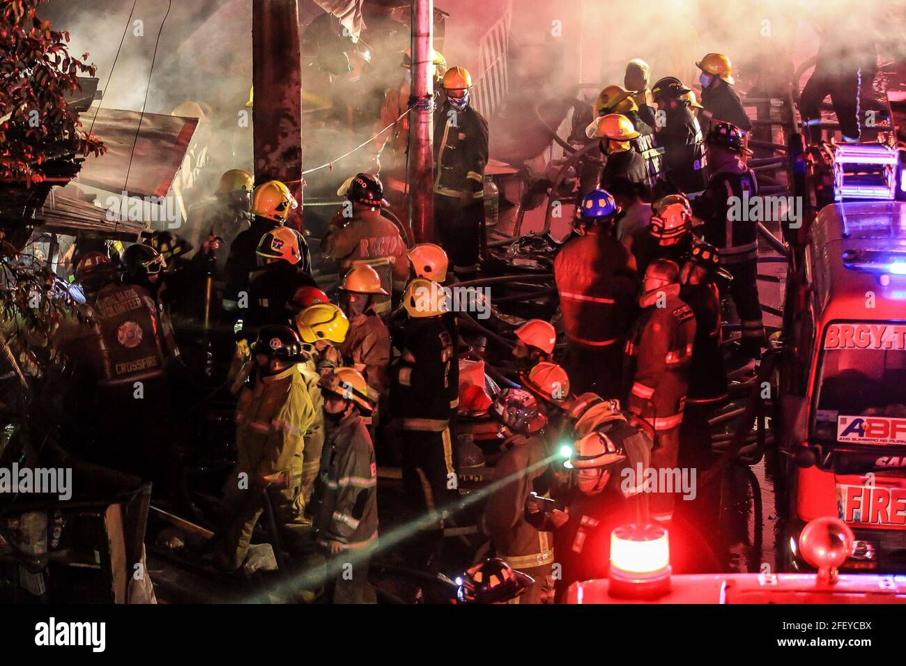 Quezon City, Philippines. 24th Apr, 2021. Firefighters try to put out a ...