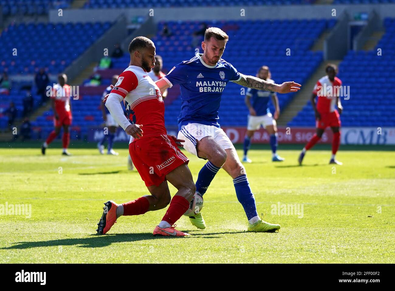 Wycombe Wanderers' Curtis Thompson (left) and Cardiff City's Joe Ralls ...