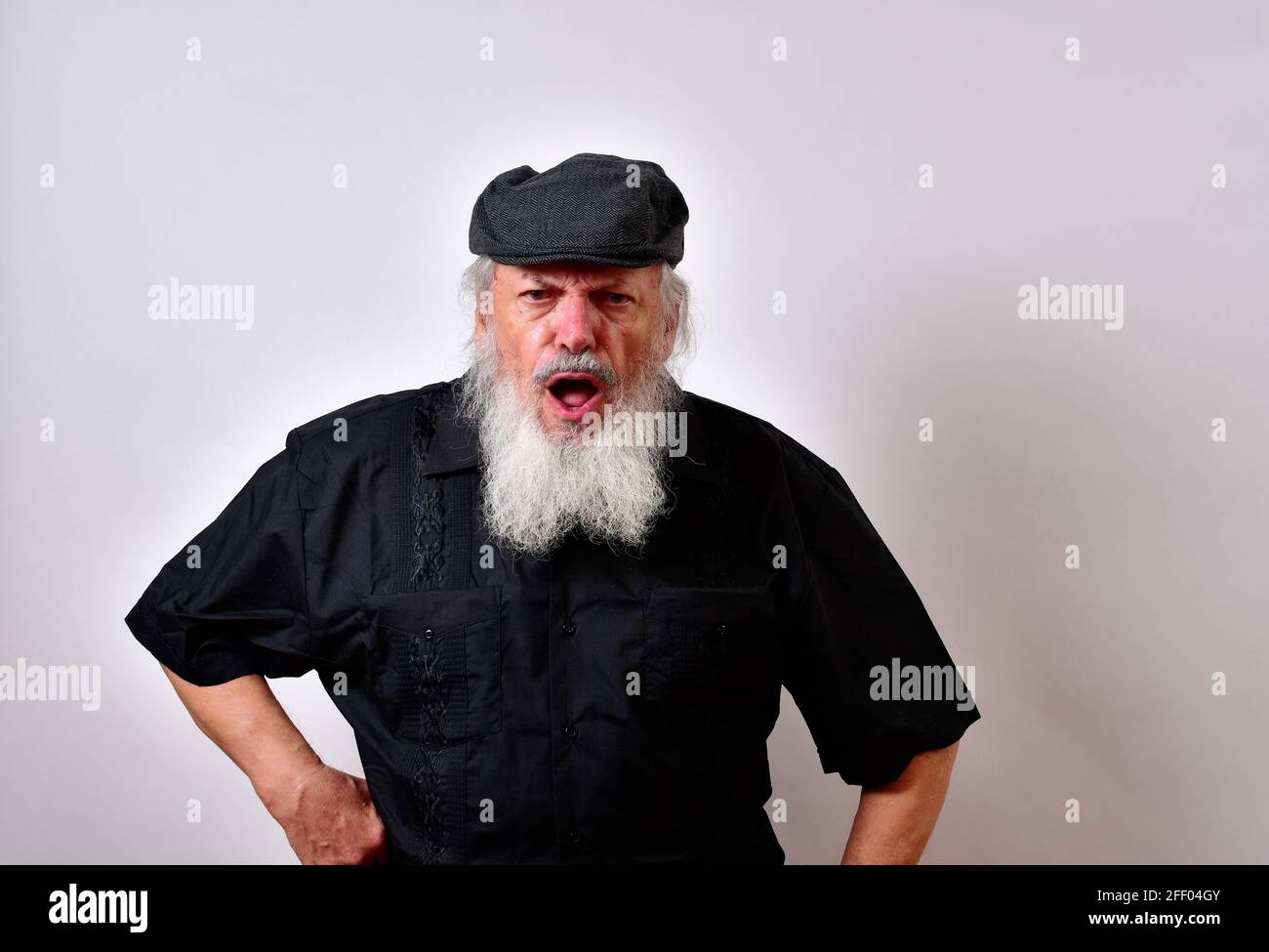 View of an elderly man shocked and angry by what he saw on a white ...