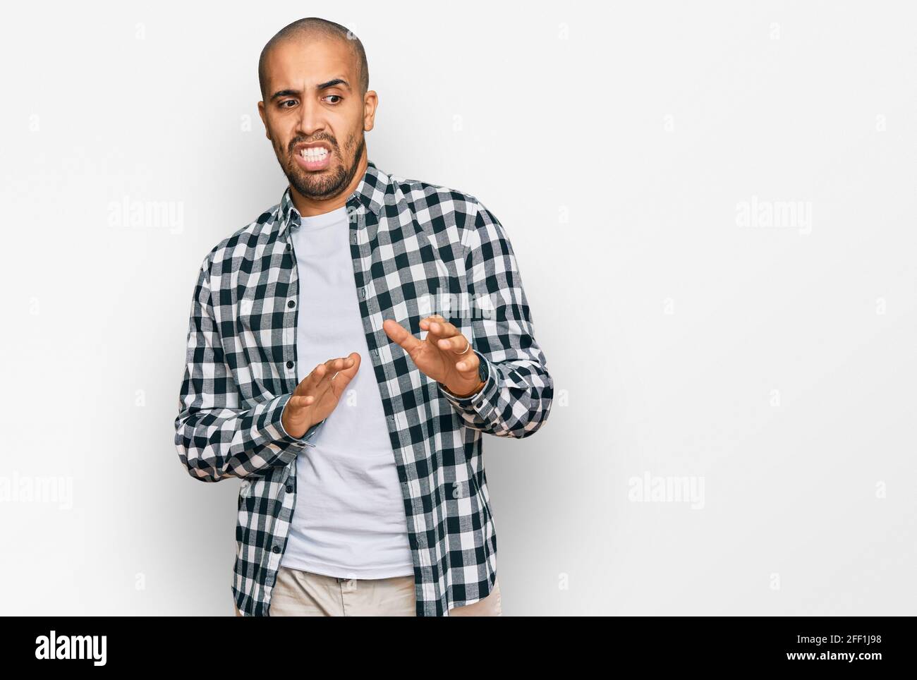 Hispanic adult man wearing casual clothes disgusted expression ...