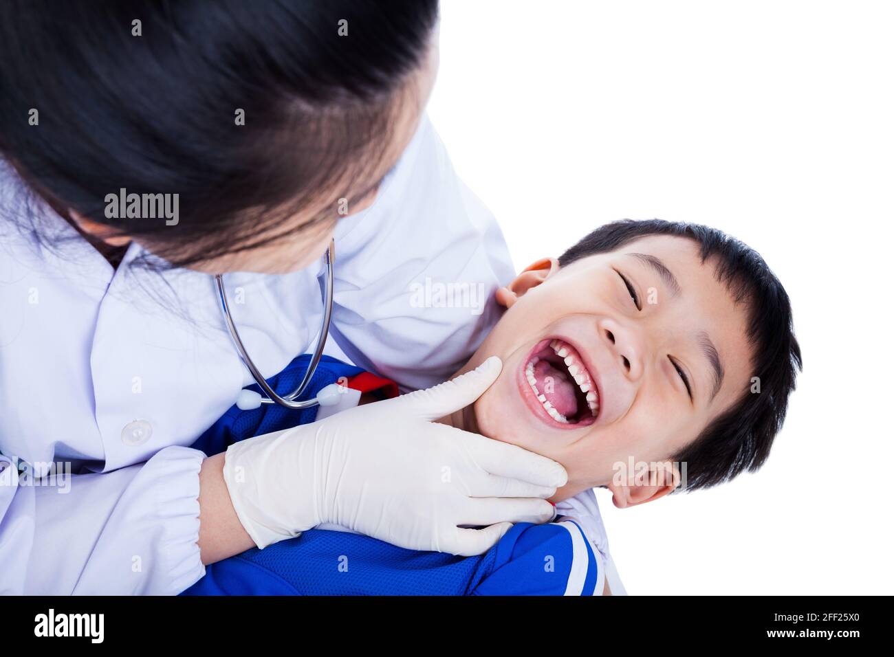 Young dentist checking oral health of child. Cute sport boy opening his ...