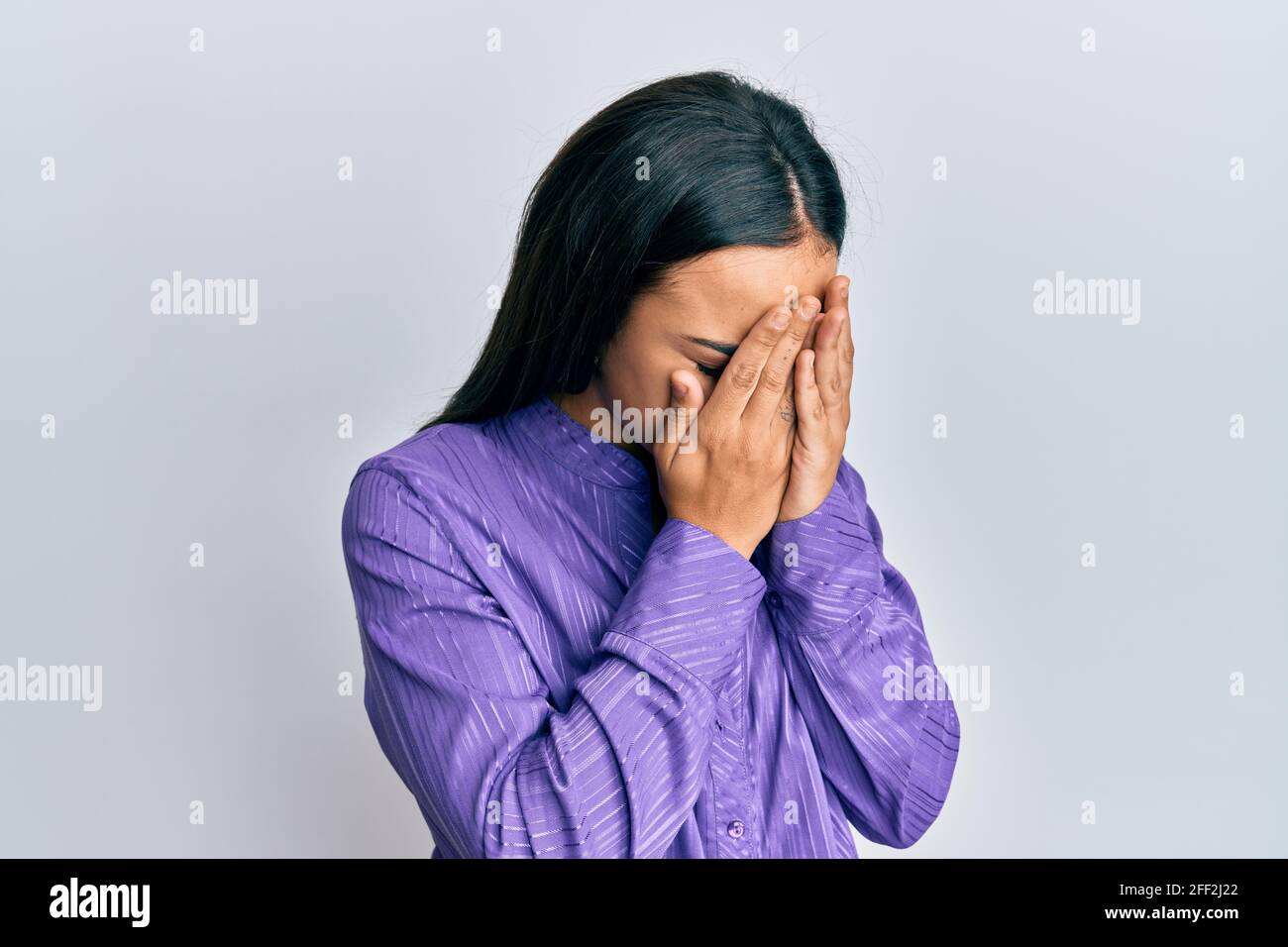 Young brunette woman wearing casual clothes with sad expression ...
