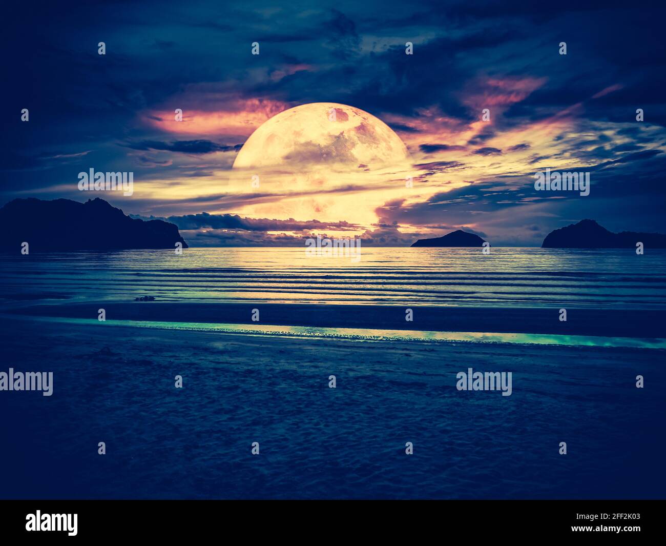 Super moon. Colorful sky with bright full moon over seascape. Serenity ...