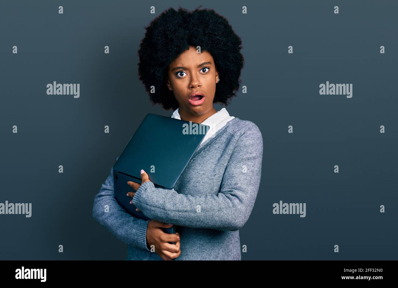 Suspicious woman and computer hi-res stock photography and images - Alamy