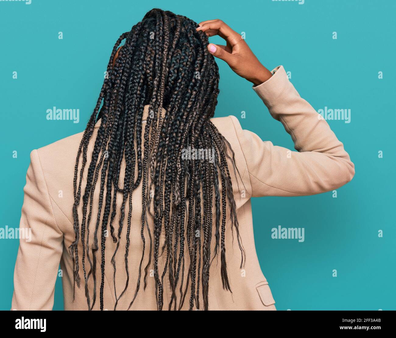 African american woman wearing business jacket backwards thinking about ...
