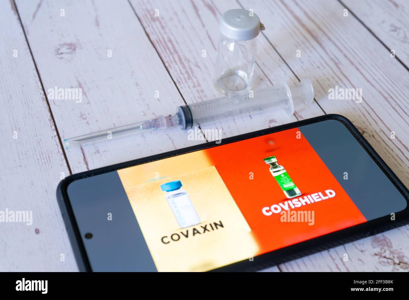 Mobile phone showing the covid 19 coronavirus vaccines covishield ...
