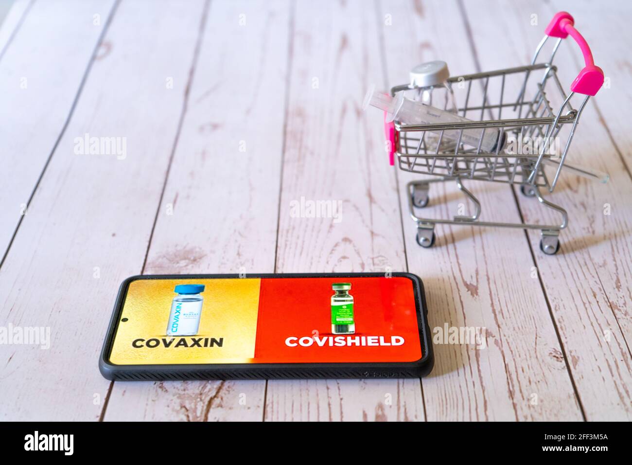 mobile phone showing vaccines choices covishield covaxin astrazeneca ...