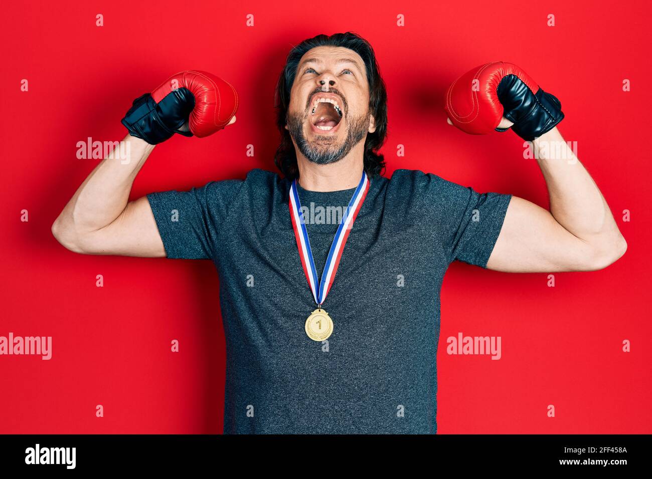 Middle age caucasian man wearing first place medal on boxing ...