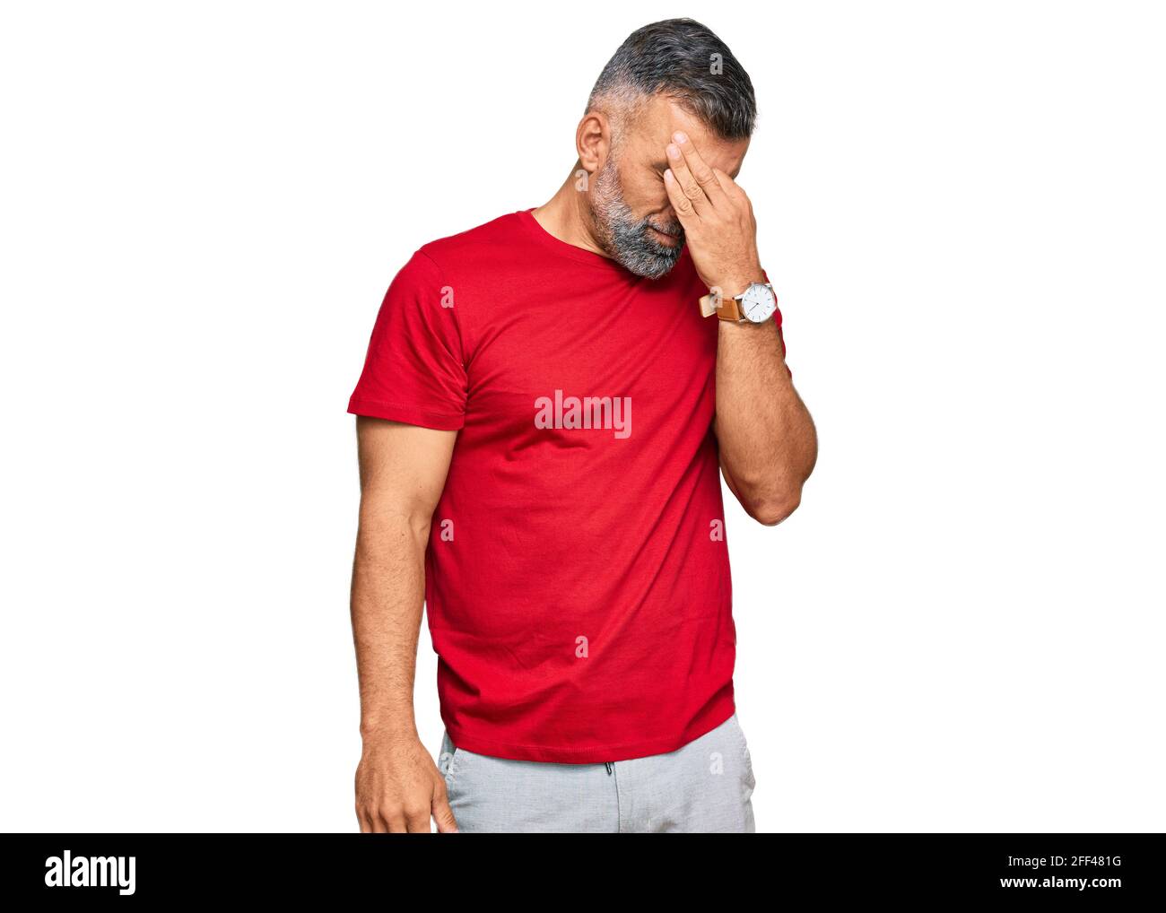 Middle age handsome man wearing casual clothes tired rubbing nose and ...