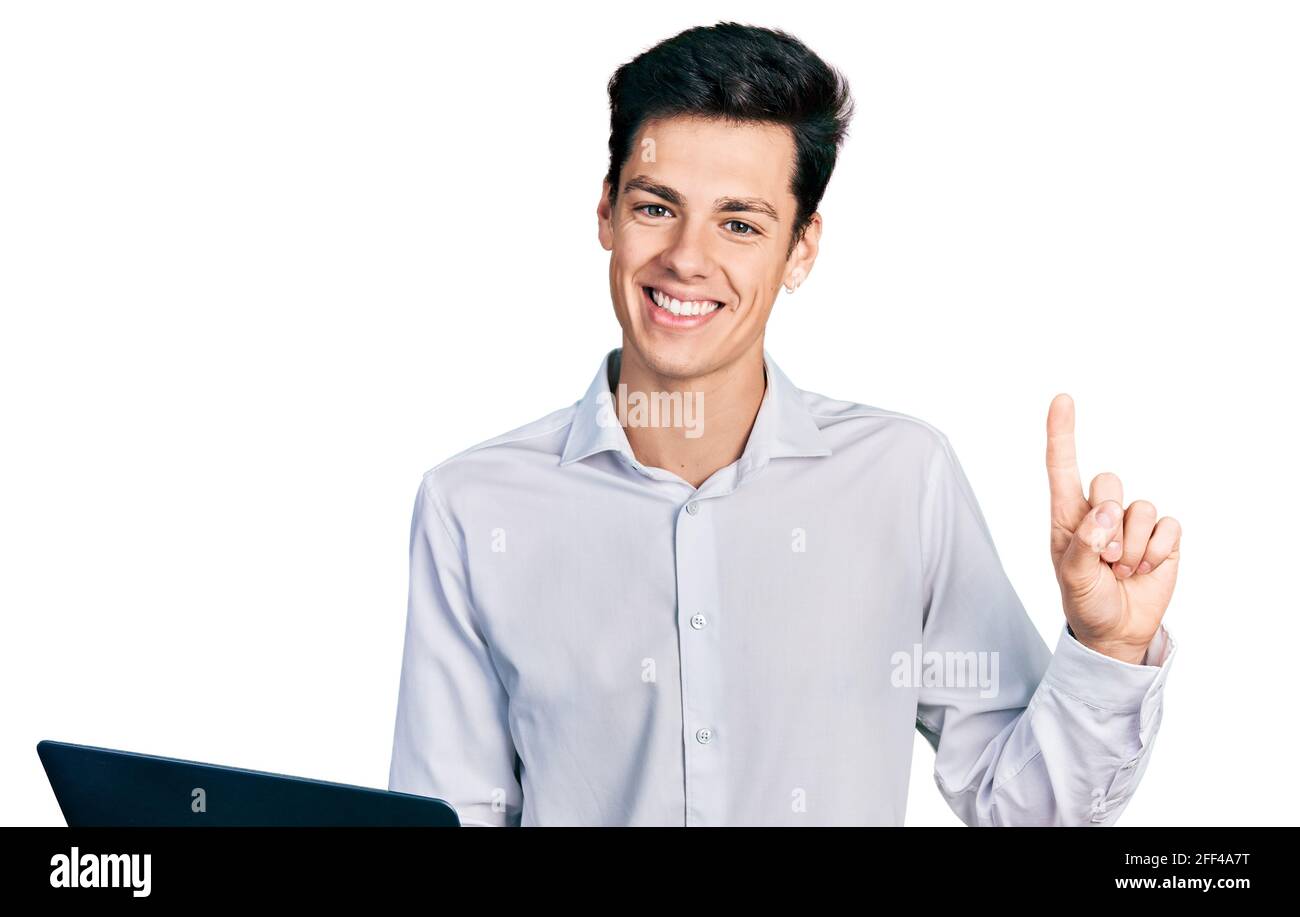 Young hispanic business man working using computer laptop smiling with ...