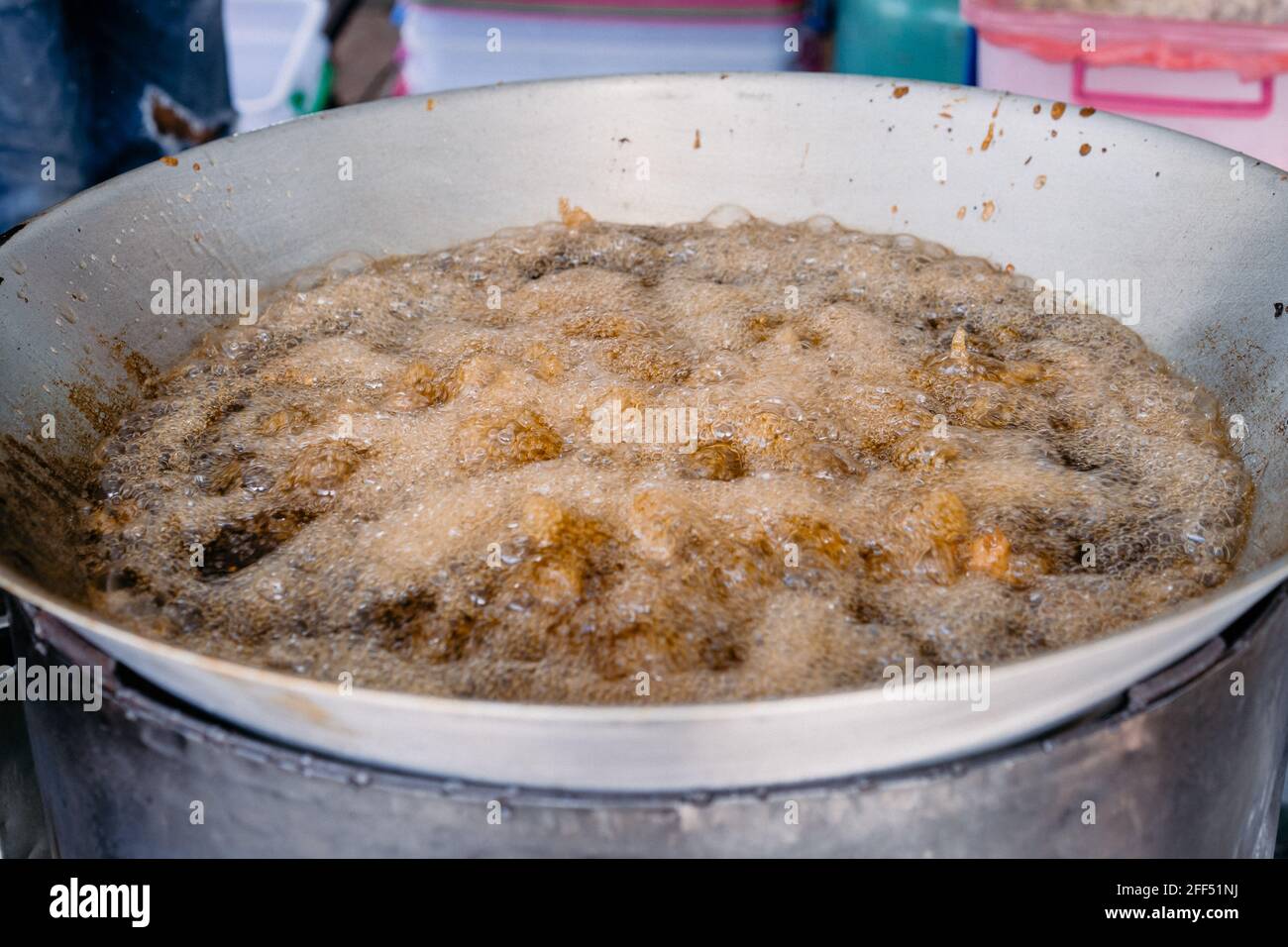 Asian Fried Chicken are fried by palm oil in the large pan Stock Photo ...