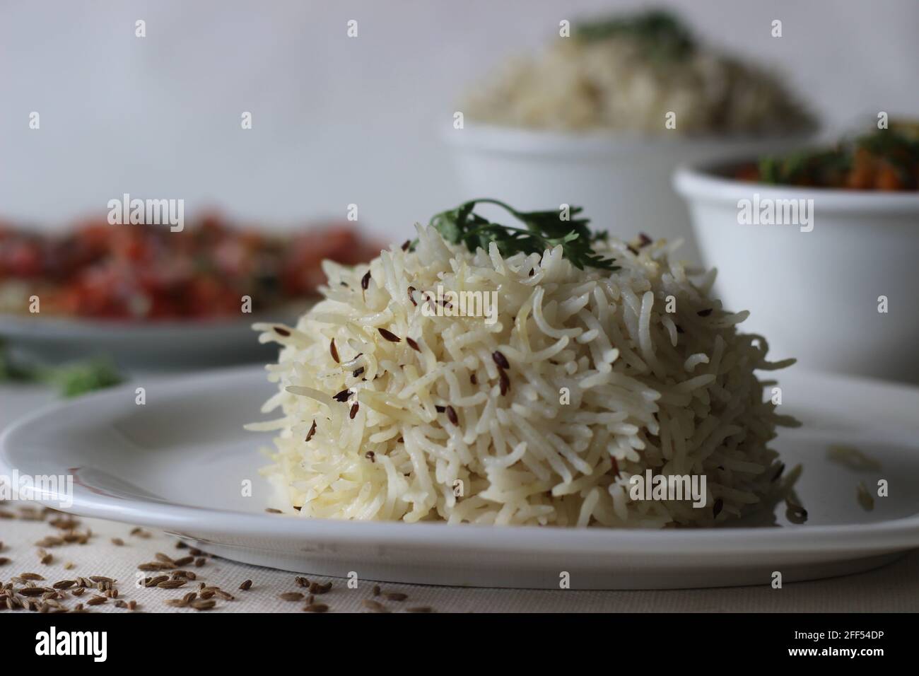 Indian dish made of basmati rice flavoured with cumin seeds and spices ...