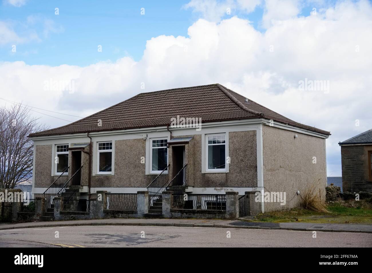 Derelict council house in poor housing estate slum with many social ...