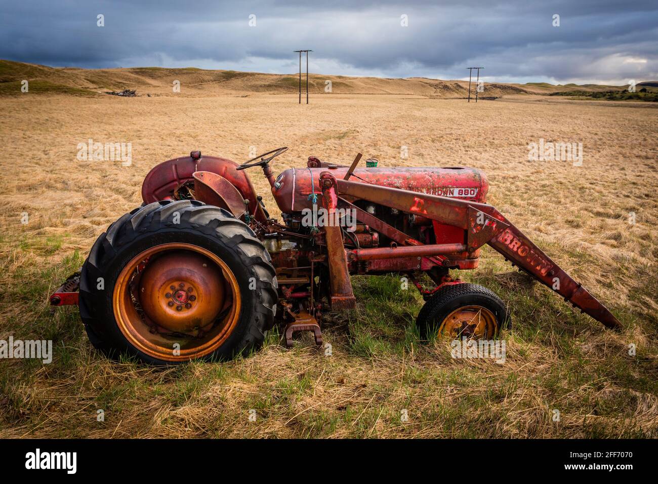 This old red tractor is one of the many abandoned vehicles at Holmur ...