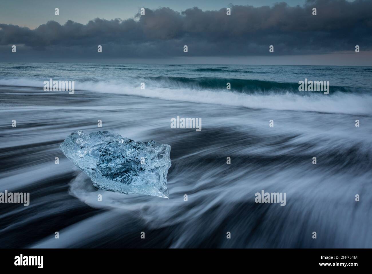 Stranded ice in black sand beach near Jokulsarlon lagoon Stock Photo ...