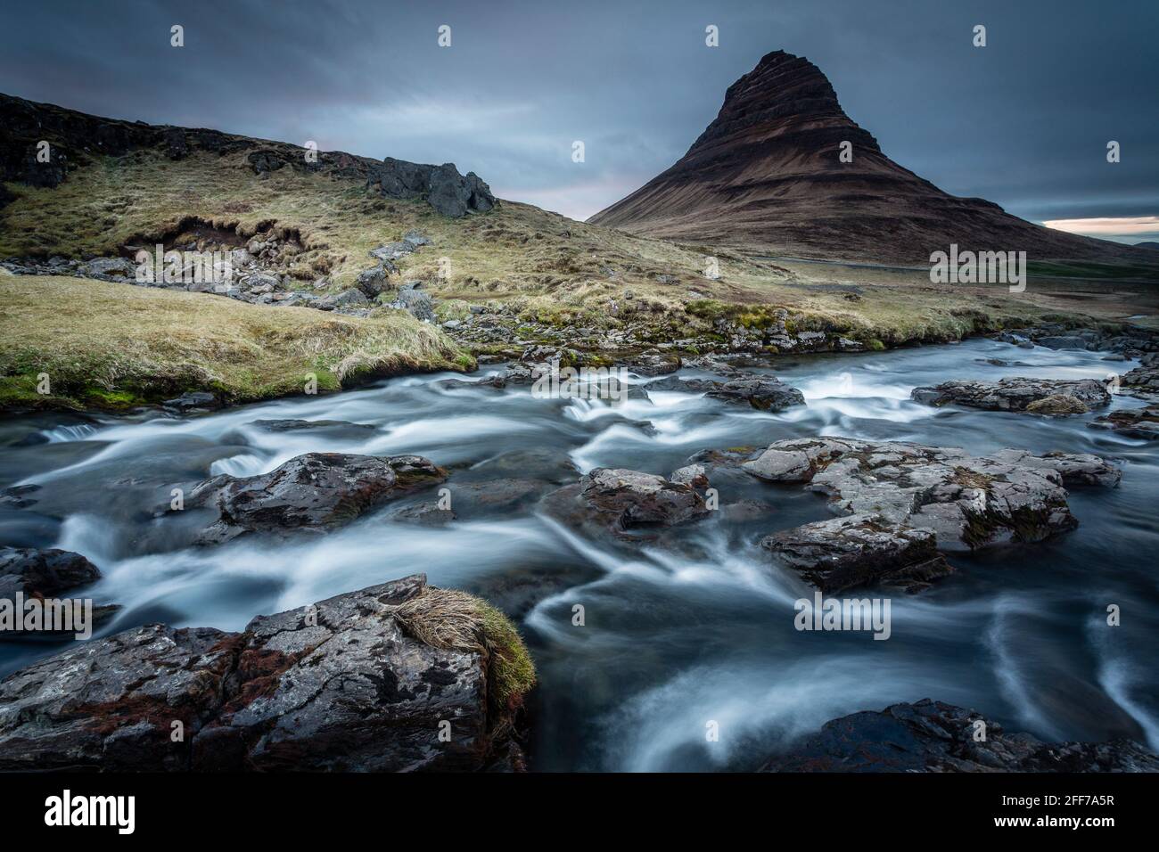 Kirkjufellsfoss waterfall and Kirkjufell mountain, in Snaefellsnes ...