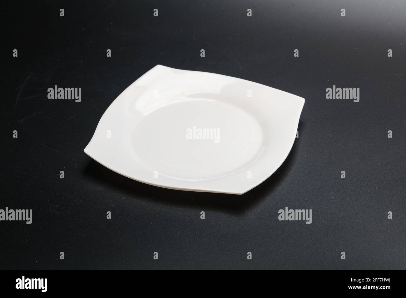 White empty plate for serving isolated Stock Photo - Alamy