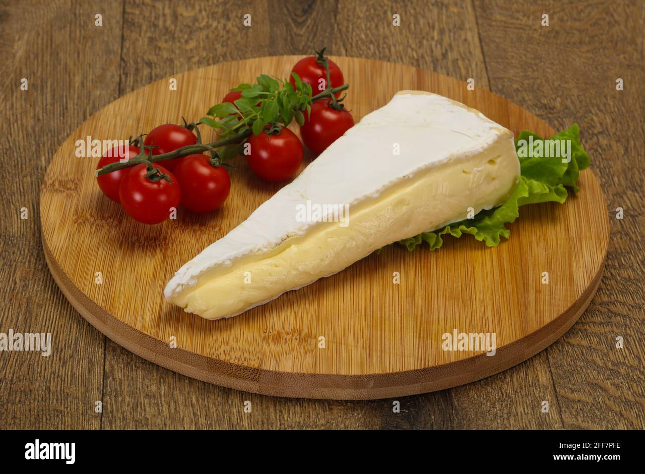 Brie cheese triangle served salad leaves Stock Photo - Alamy