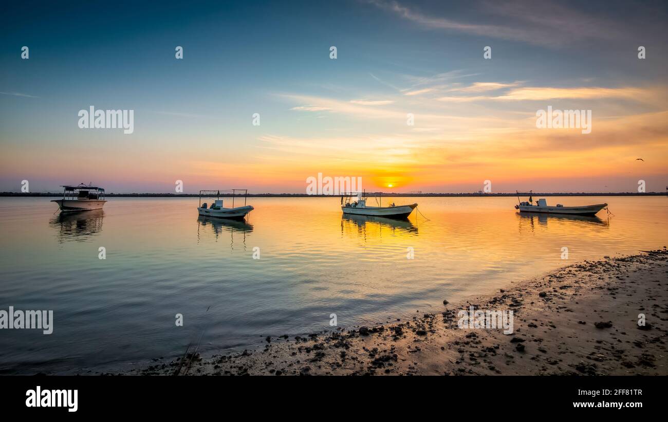 Boats on Dammam sea side with sunrise background view. Dammam, Saudi ...