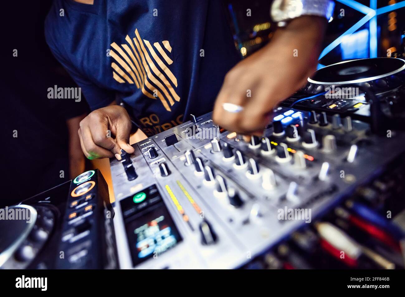 professional panel DJ mixer with hand controlling mixing music in ...