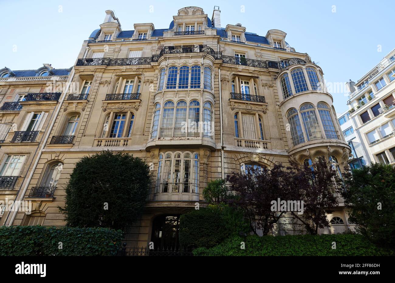 Traditional French house with typical balconies and windows. Paris ...