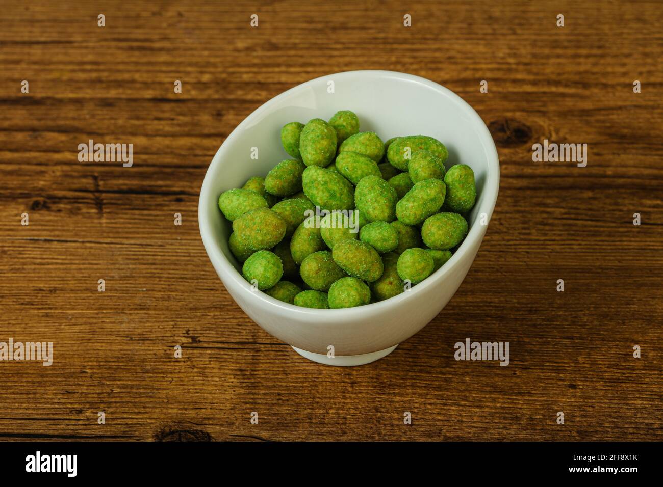 Spicy wasabi peanuts snack in the bowl Stock Photo - Alamy