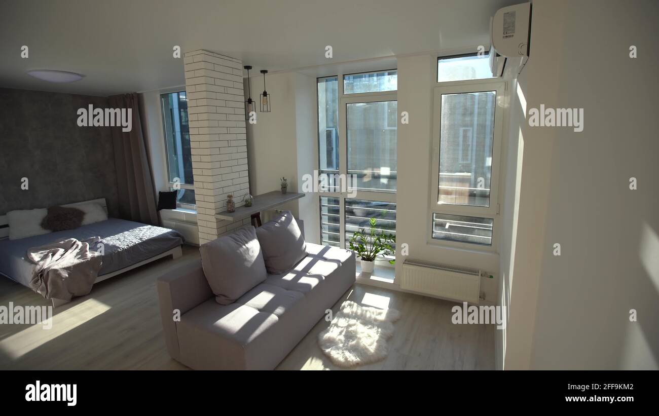 cozy and spacious studio apartment with modern minimalistic interior ...