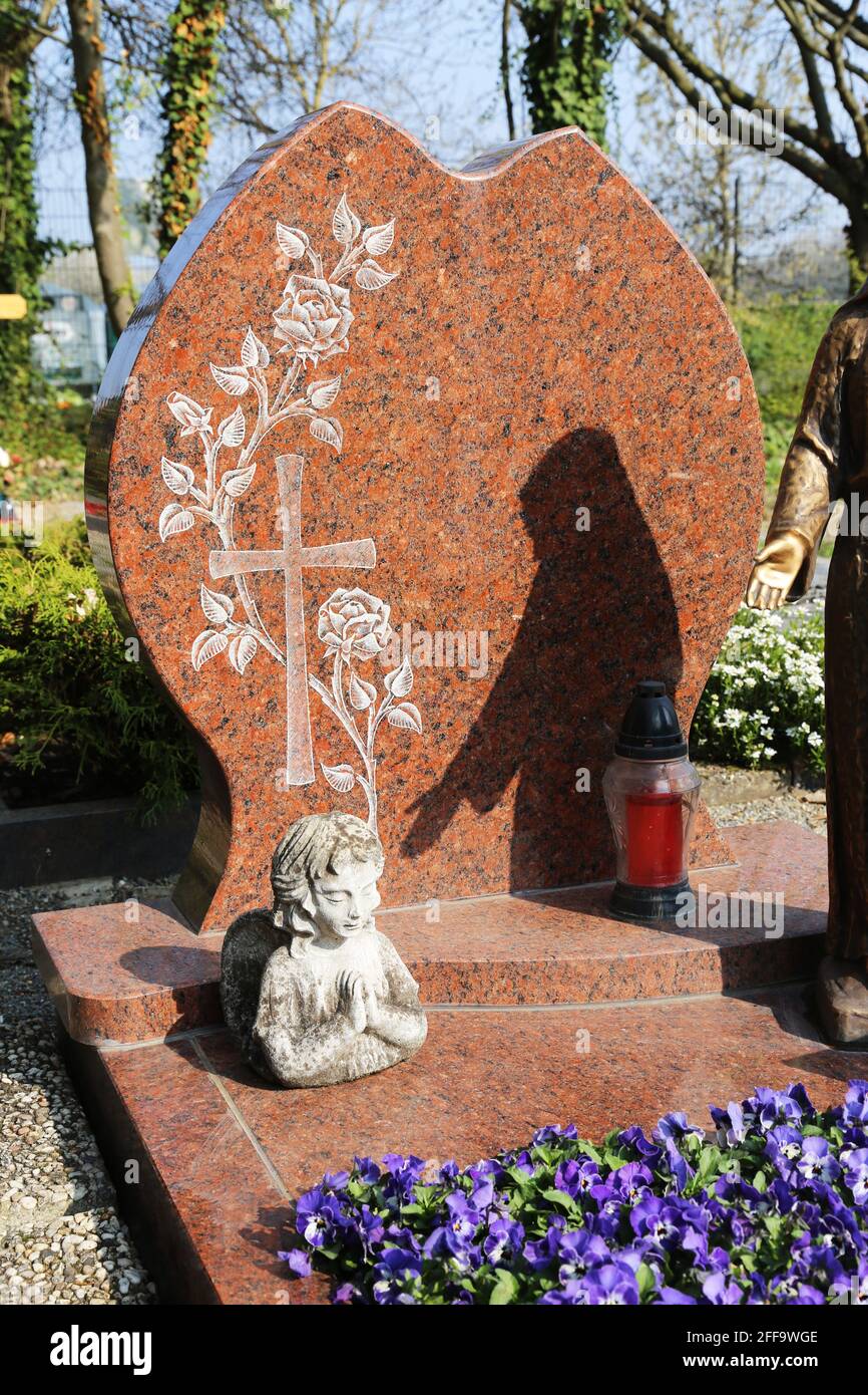 Grave with beautiful gravestone Stock Photo - Alamy