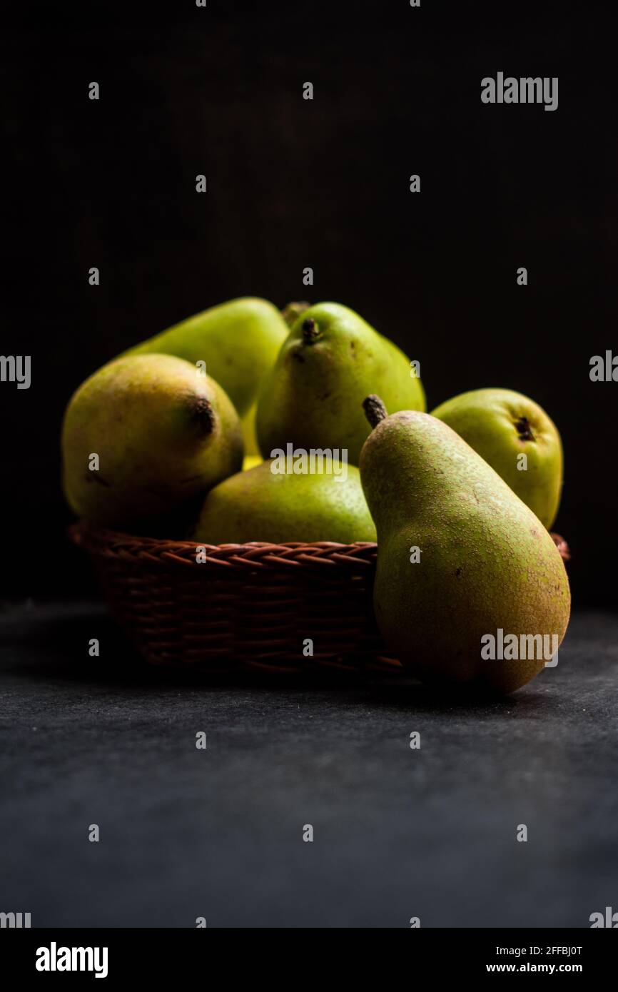Green pears in basket hi-res stock photography and images - Alamy