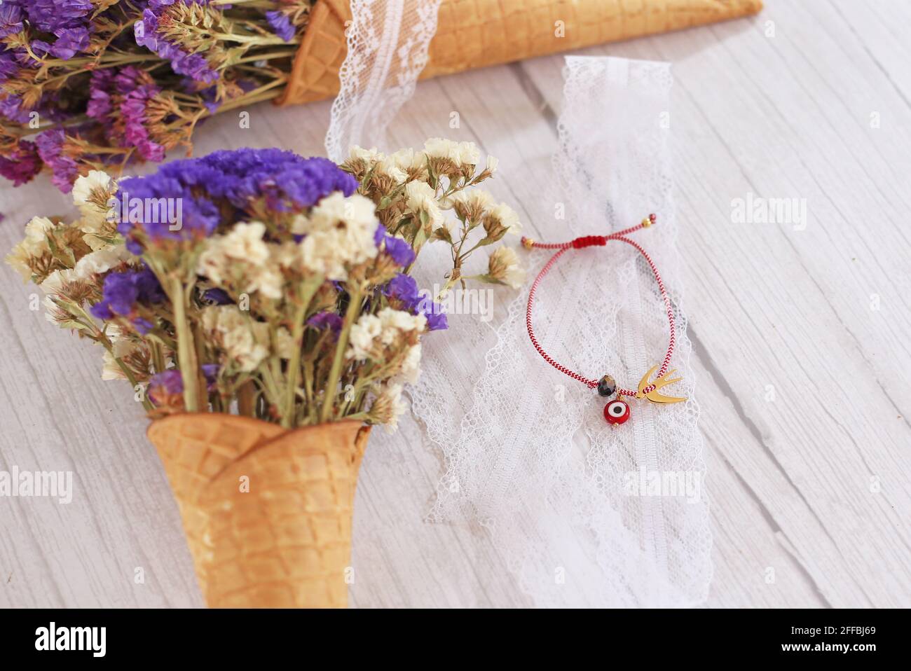 traditional greek March bracelet with red and white cord on the tree ...