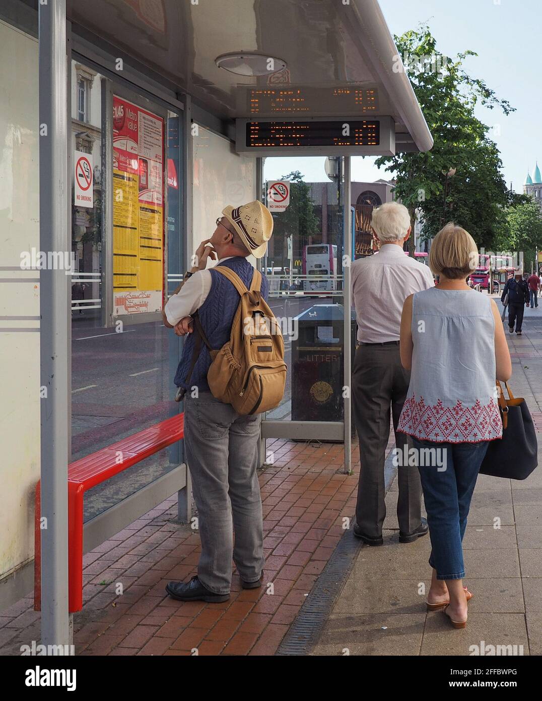 BELFAST, UK - CIRCA JUNE 2018: People at bus stop in the city of ...