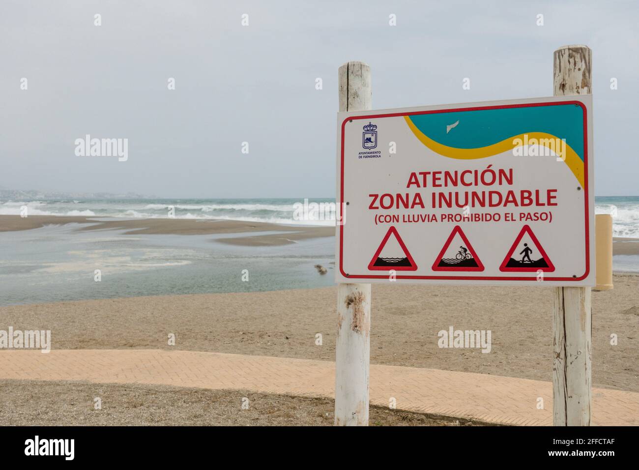 Sign no passing, Fuengirola river mouth, Rio Fuengirola flooded after ...