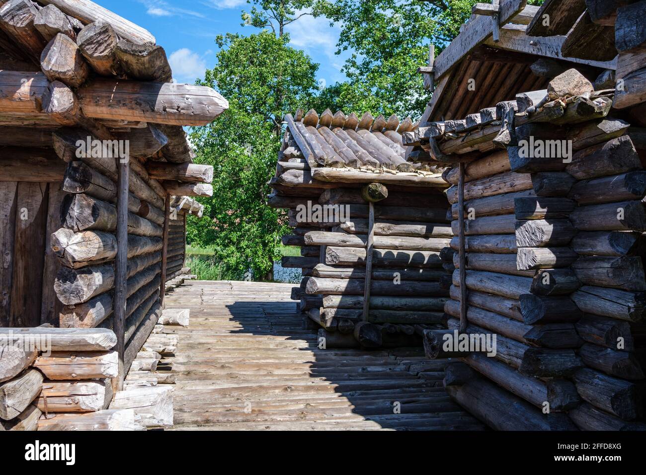 details of old restored wooden log castle. settlement of ancient people ...