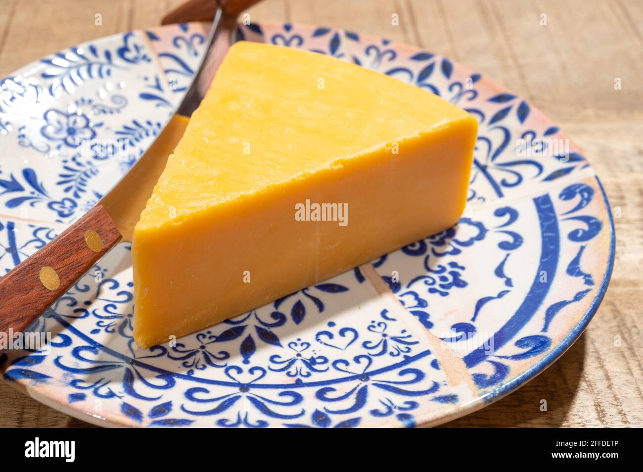 Cheese collection, piece of matured British yellow cheddar cheese made ...