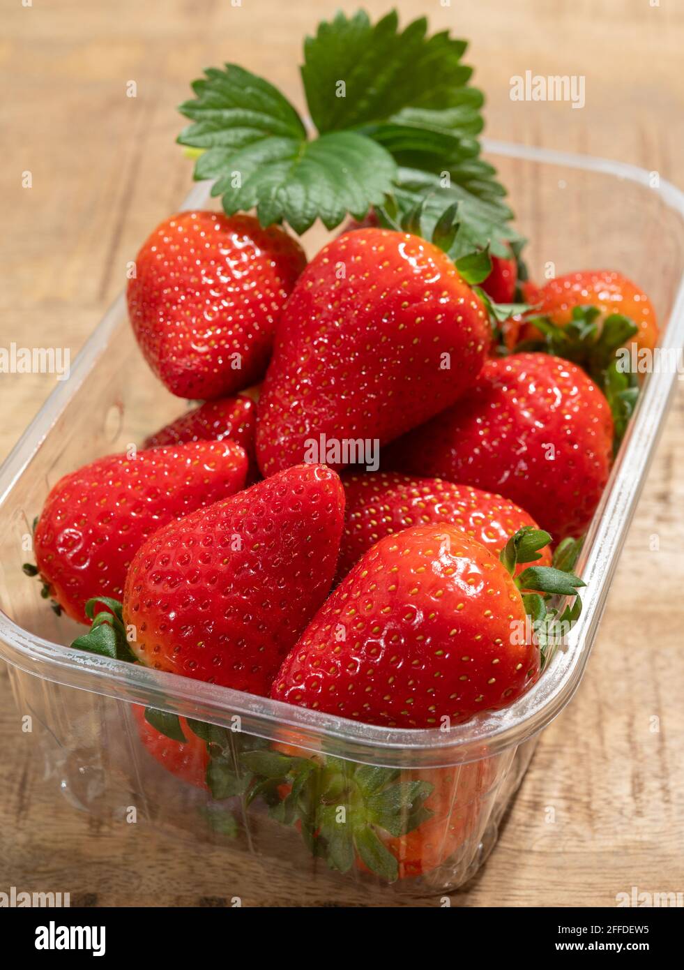 New harvest, plastic box of ripe red sweet strawberry ready to eat ...