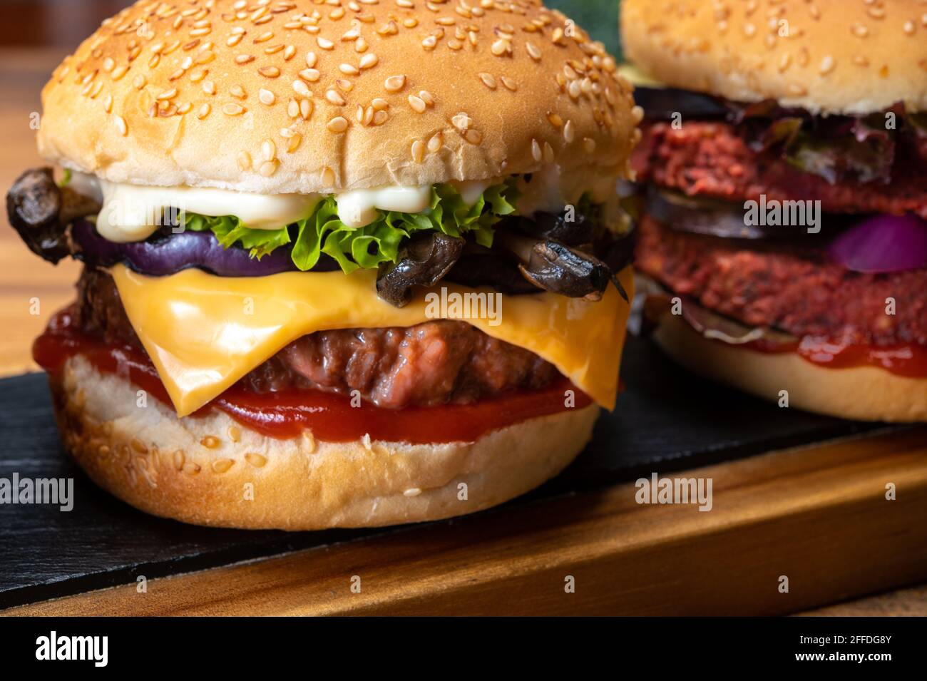 Tasty vegetarian cheeseburgers and hamburgers with round patties or ...
