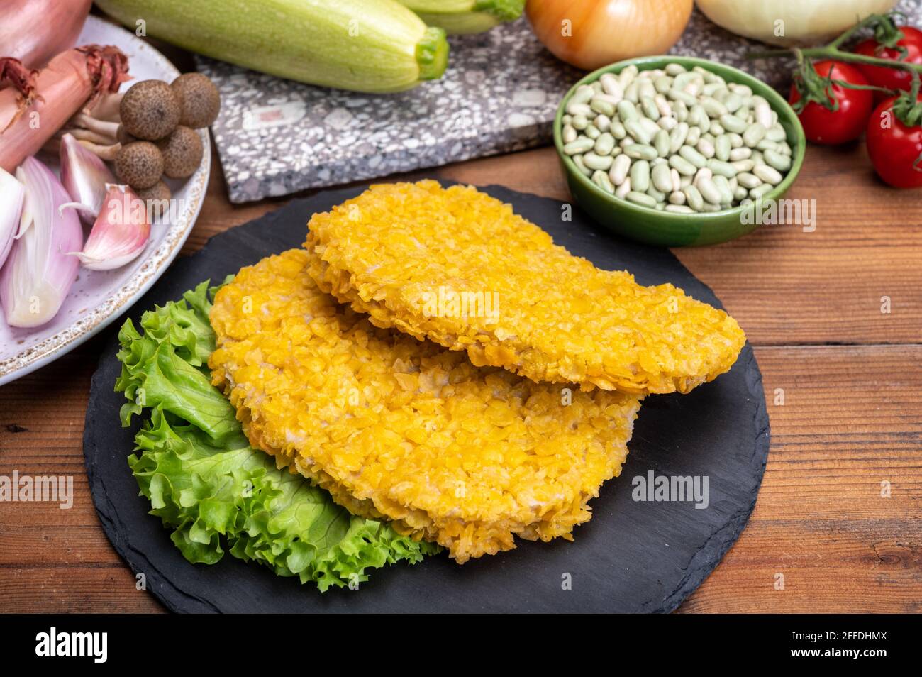 Vegetarian schnitzel made from grains, soybeans, mais, vegetables and ...