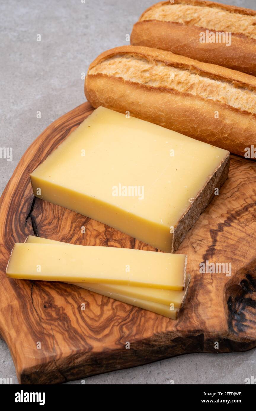French food - piece of cheese comte made from cow milk in region ...
