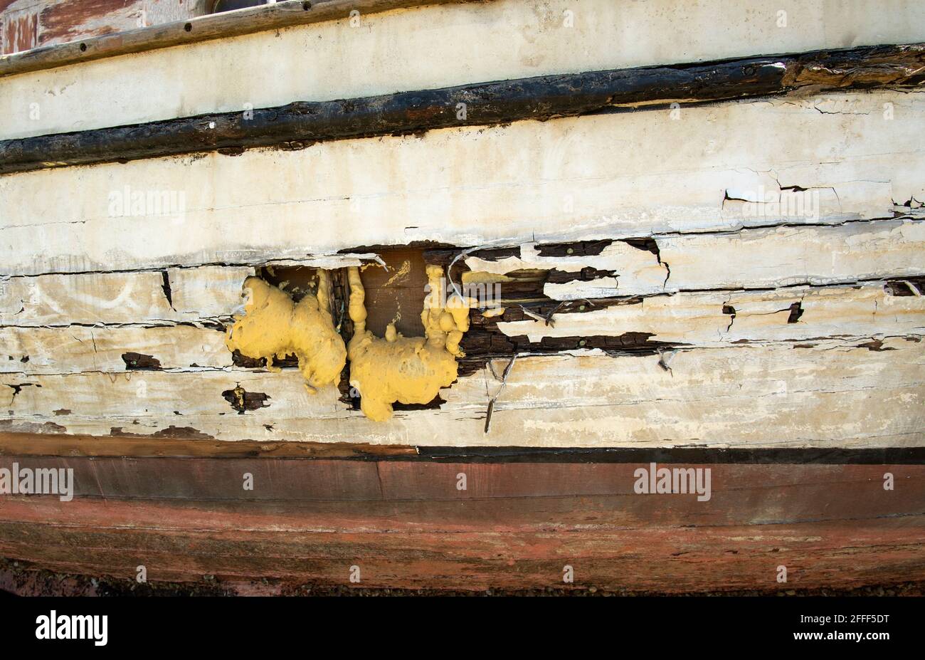 Wooden boat with damaged hull repaired with expanding foam Stock Photo ...