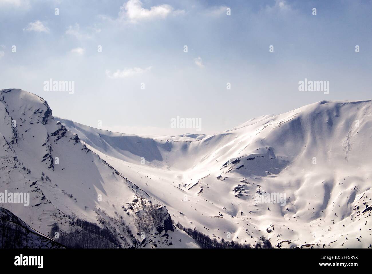 Amazing view of beautiful snow-capped mountains under the sunlight ...