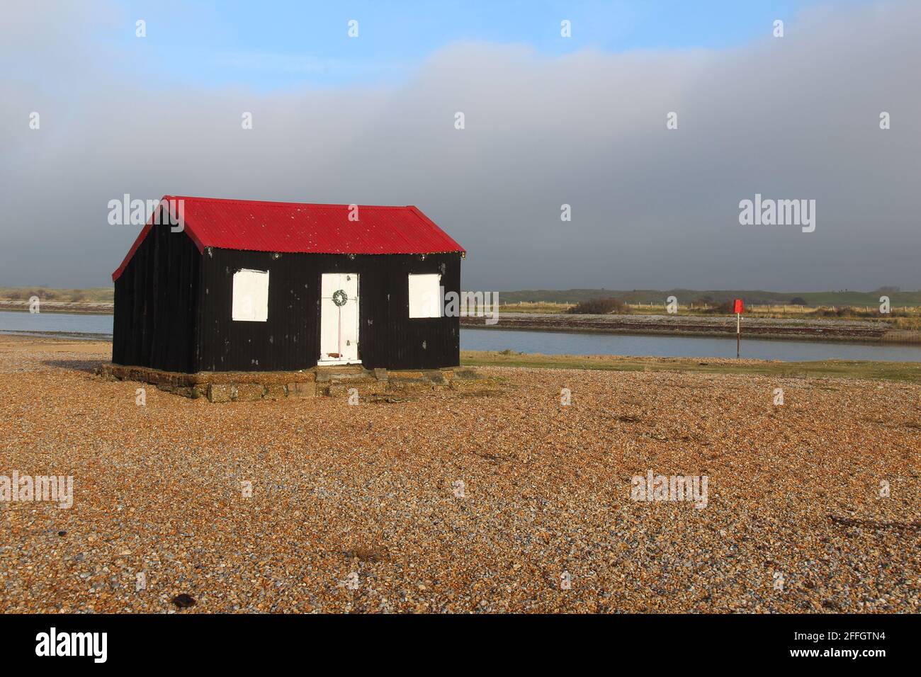RED ROOFED HUT AT RYE HARBOUR WILDLIFE RESERVE IN SUSSEX Stock Photo ...