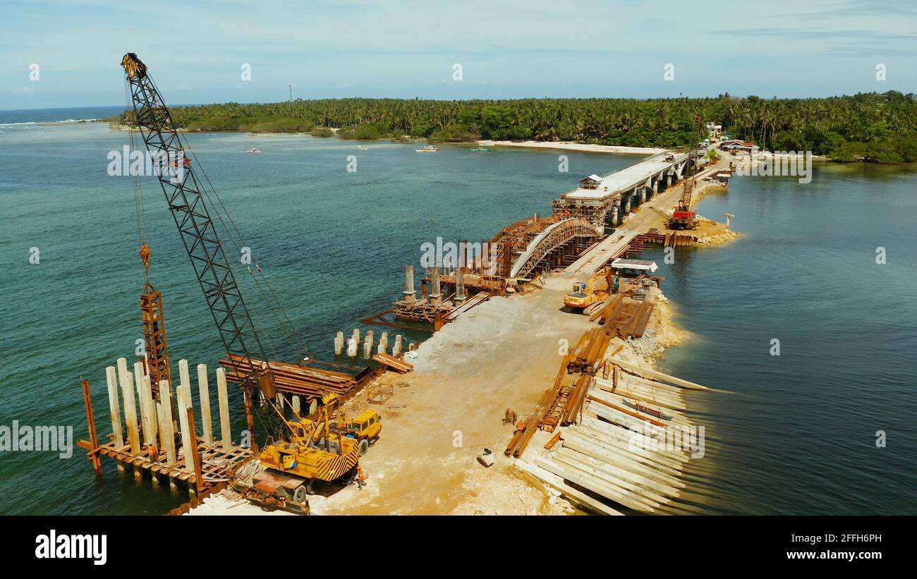 Pile hammer working on construction site. Bridge under construction ...