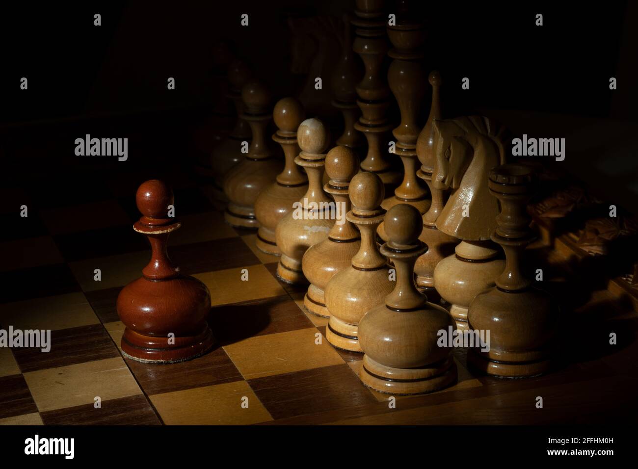 old chess, pawn stand which flare light surrounded by falling around ...