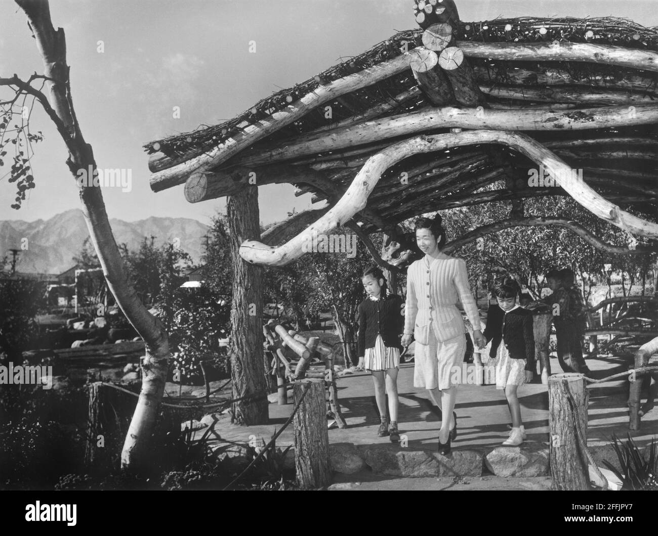 Yaeko Nakamura holding hands with her two Daughters, Joyce Yuki and ...
